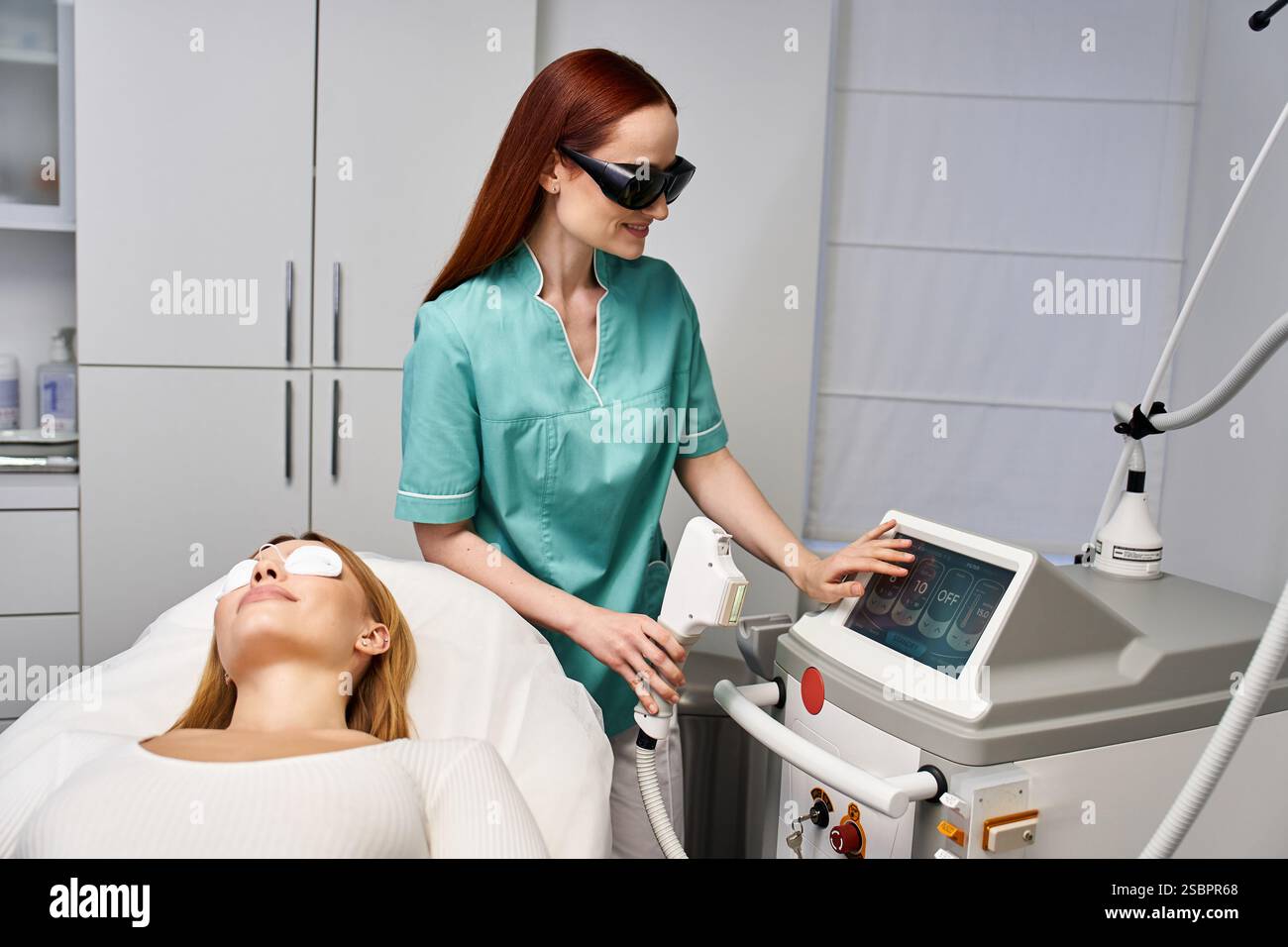 A young woman receives a skin treatment from a professional in a modern dermatology clinic Stock ...