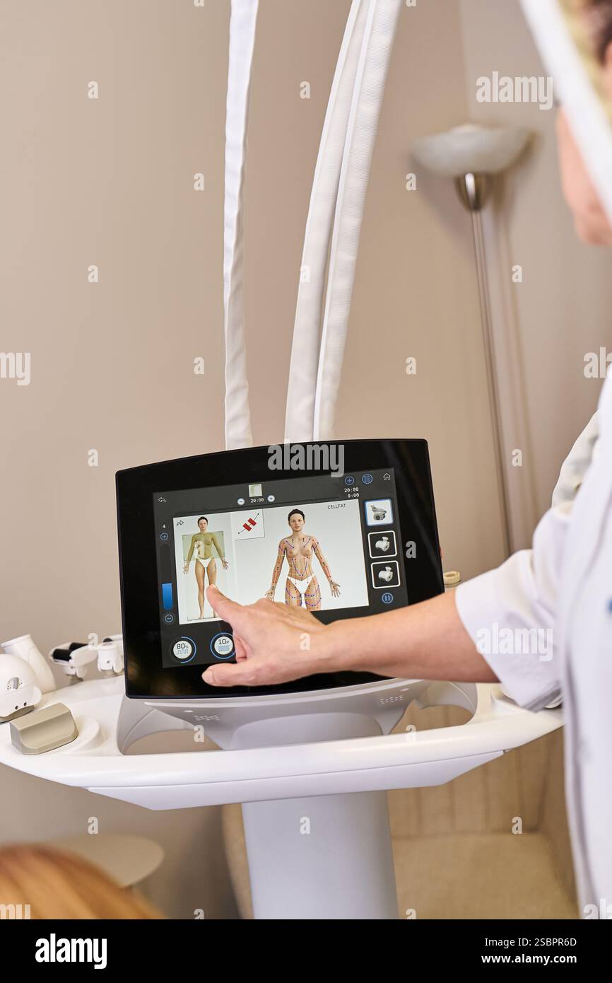 A young dermatologist treats a client using advanced skin procedure ...