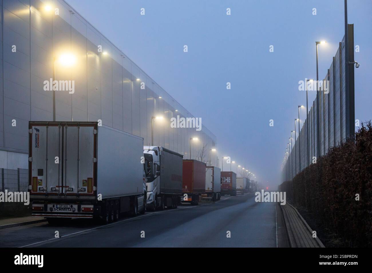 trucks parked at the REWE logistics center in the Eving district of ...