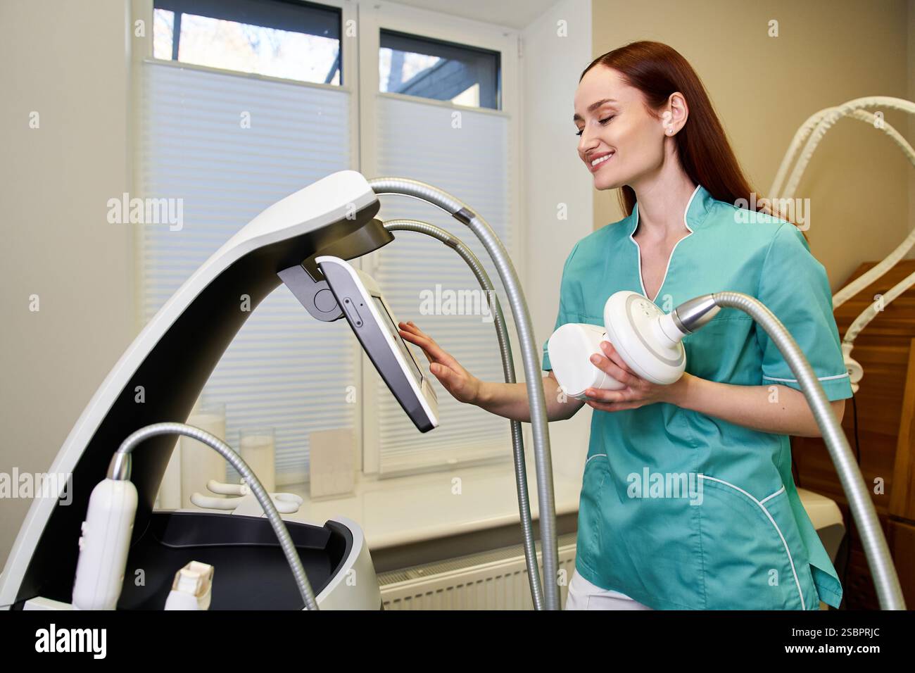 A skilled dermatologist uses advanced equipment while providing a skin ...