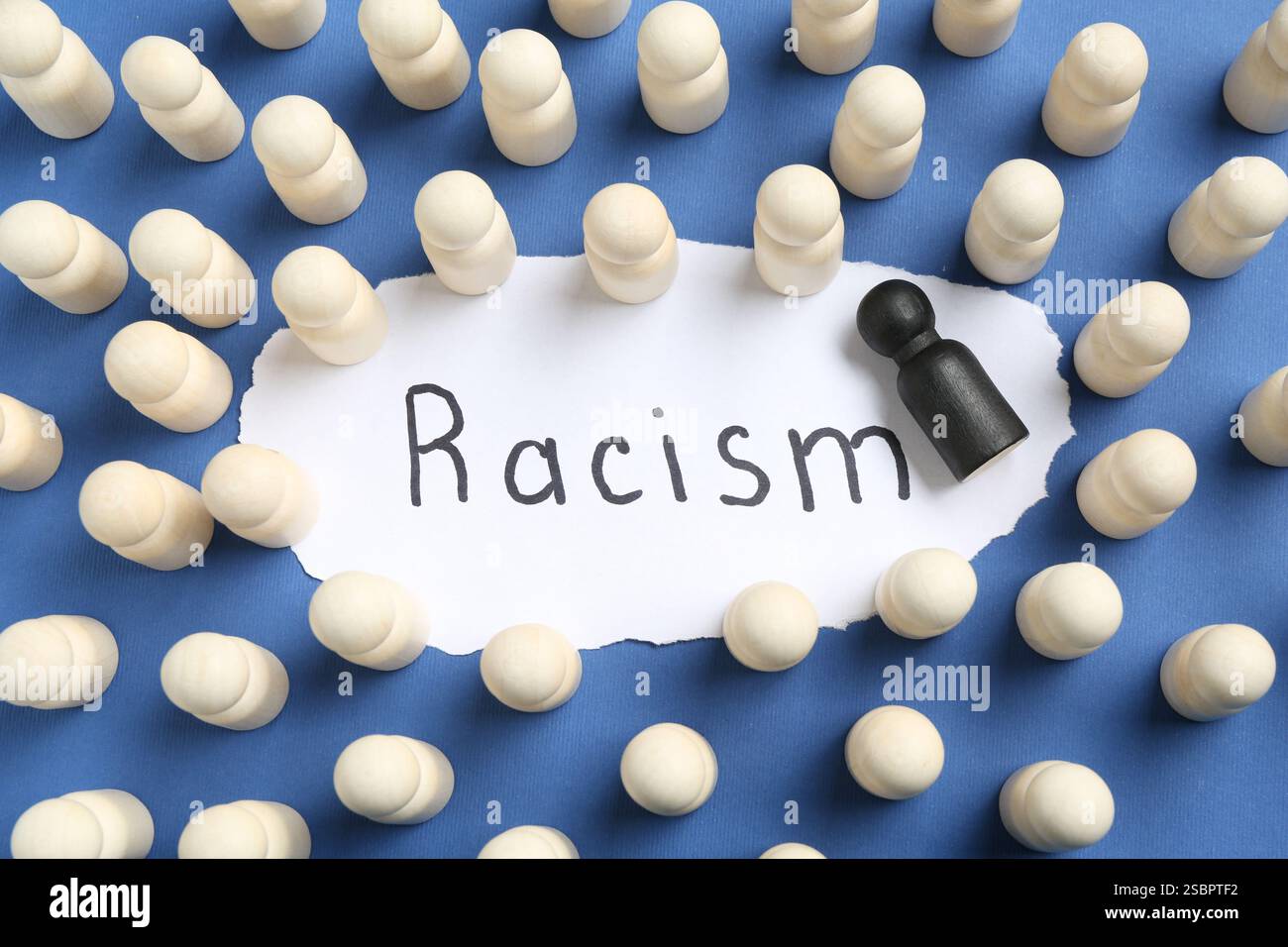 Card with word Racism and human figures of different colors on blue ...