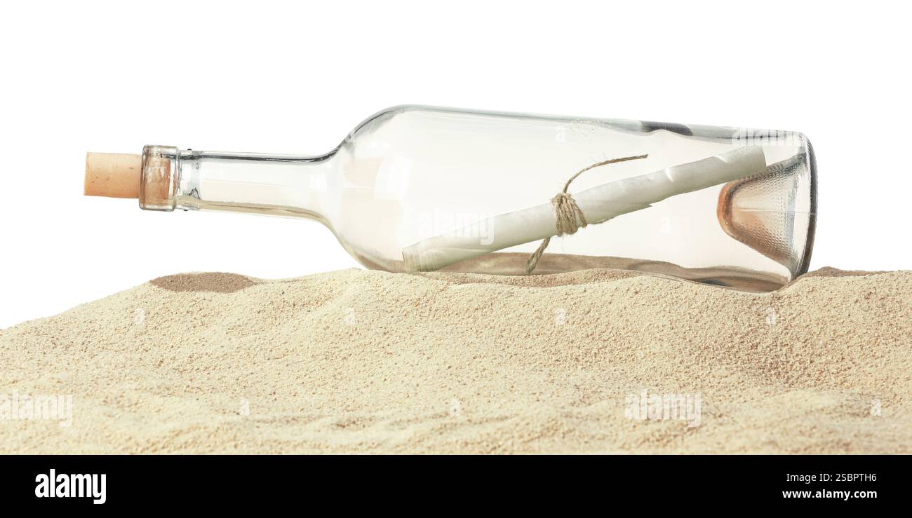 Rolled letter in corked glass bottle on sand against white background ...
