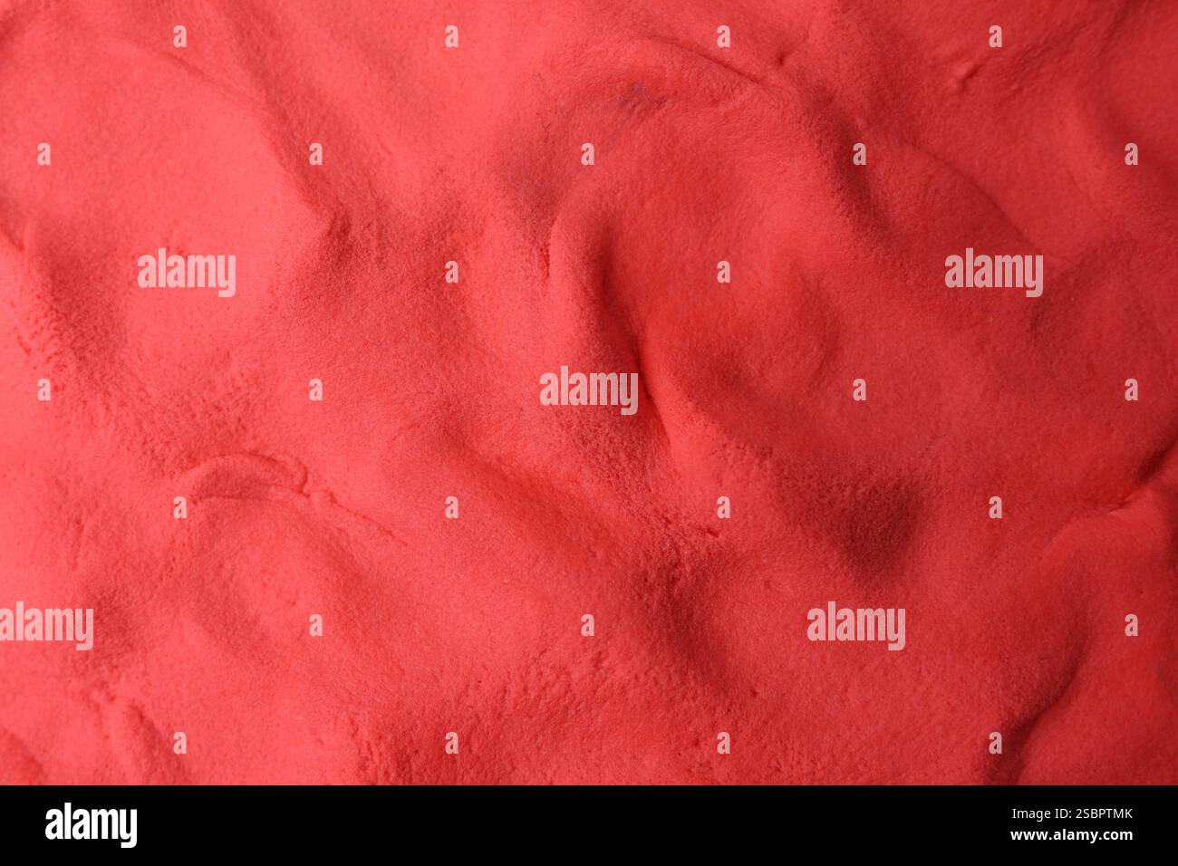 Red play dough as background, top view Stock Photo - Alamy
