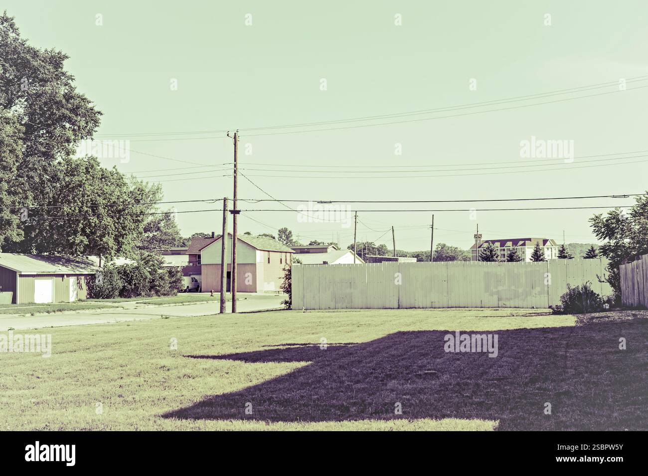 Street scene with open field in a working class neighborhood of ...