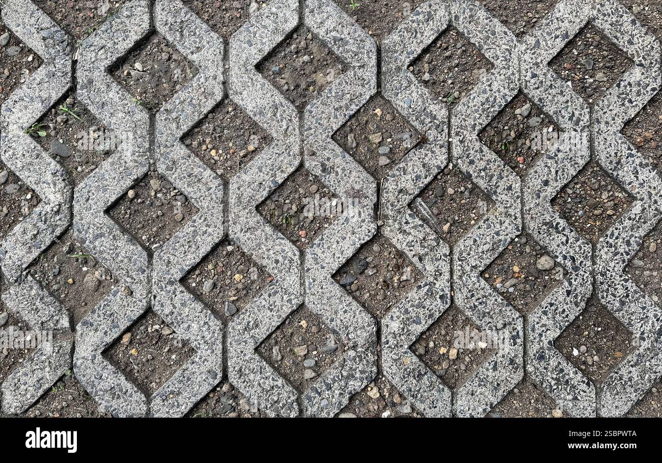 Close up of molded grey paving stone in diamond pattern. This diamond ...
