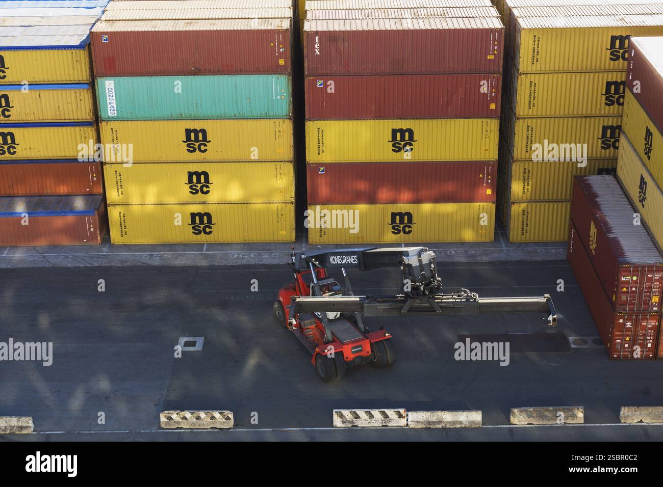 Stacked MSC, DONGFANG metal box shipping containers and Kone Cranes ...