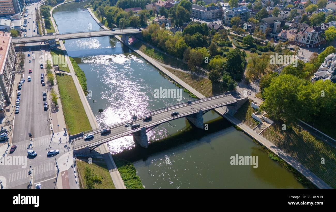 Aerial view of a city with a river running through it, featuring ...