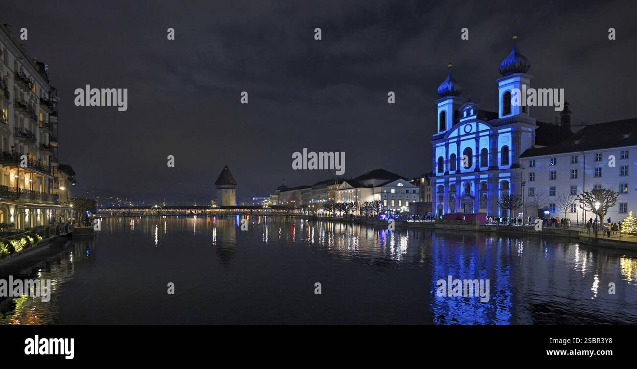 Water tower and Jesuit church on the right with light installation, on ...