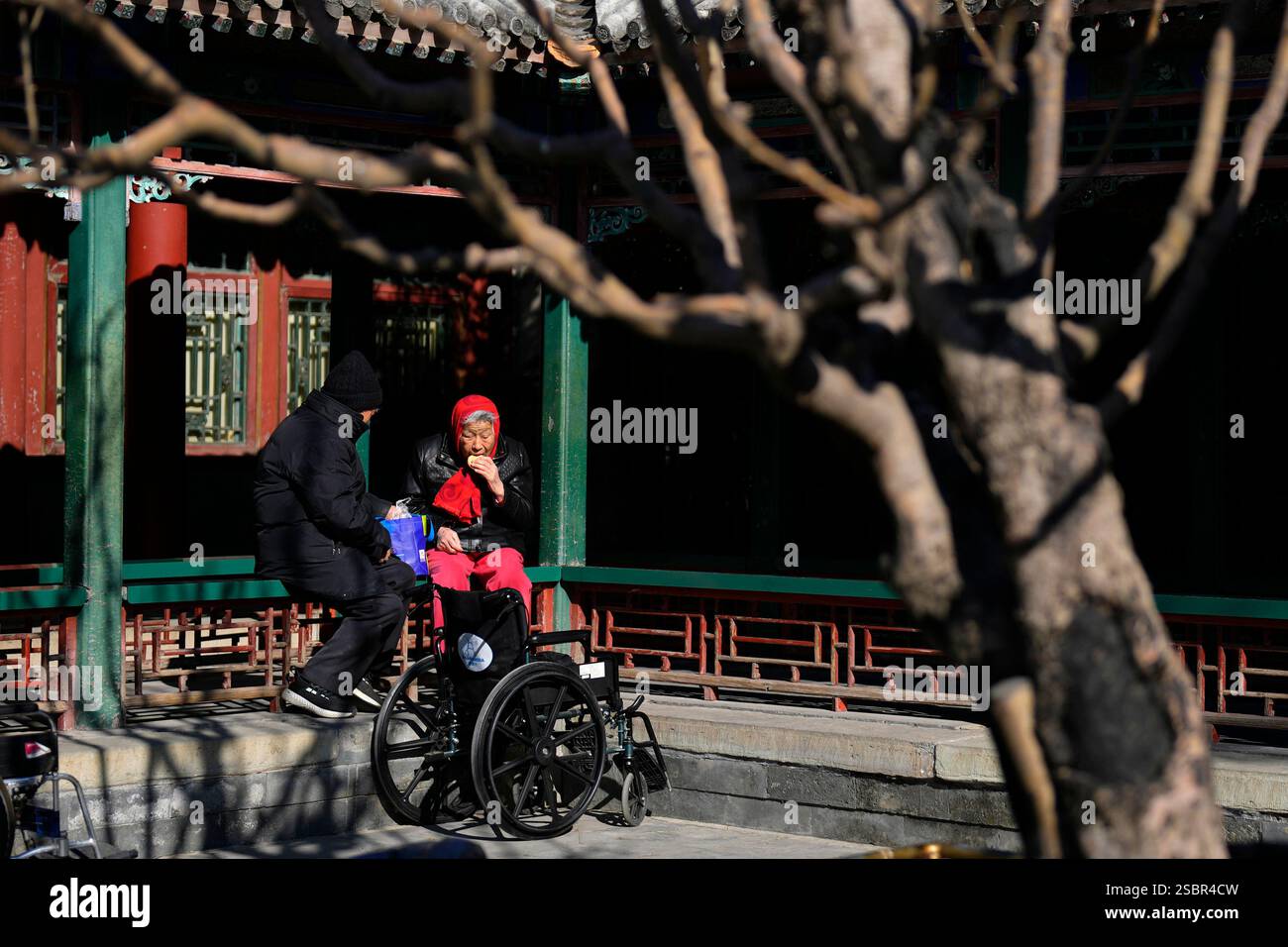 An old woman takes a break during her visit to the popular Summer ...