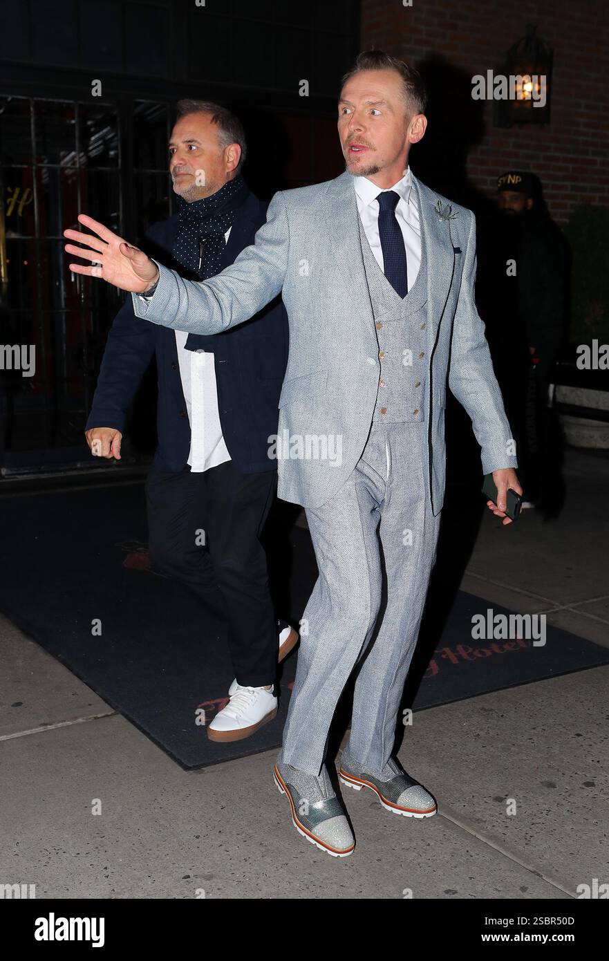 Actor Simon Pegg looks dapper in a pale blue suit as he leaves a ...