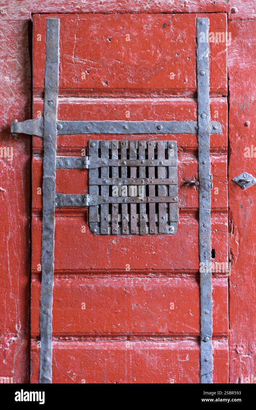 Wrought-iron grilles and fittings, red wooden door to dungeon, dungeon ...