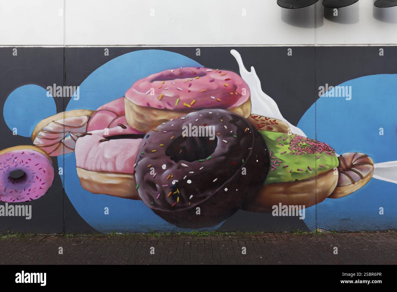 Graffiti, colourful donuts, assortment of ring-shaped doughnuts with ...