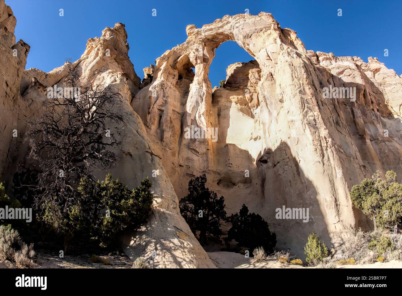 A mountain with a large archway in the middle. The archway is ...