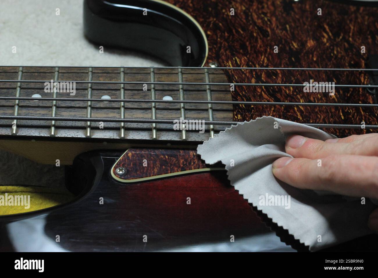 Cleaning and Polishing Electric Bass Guitar with Microfiber Cloth ...