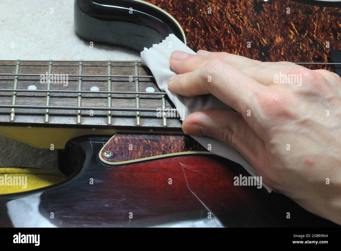 Cleaning and Polishing Electric Bass Guitar with Microfiber Cloth ...