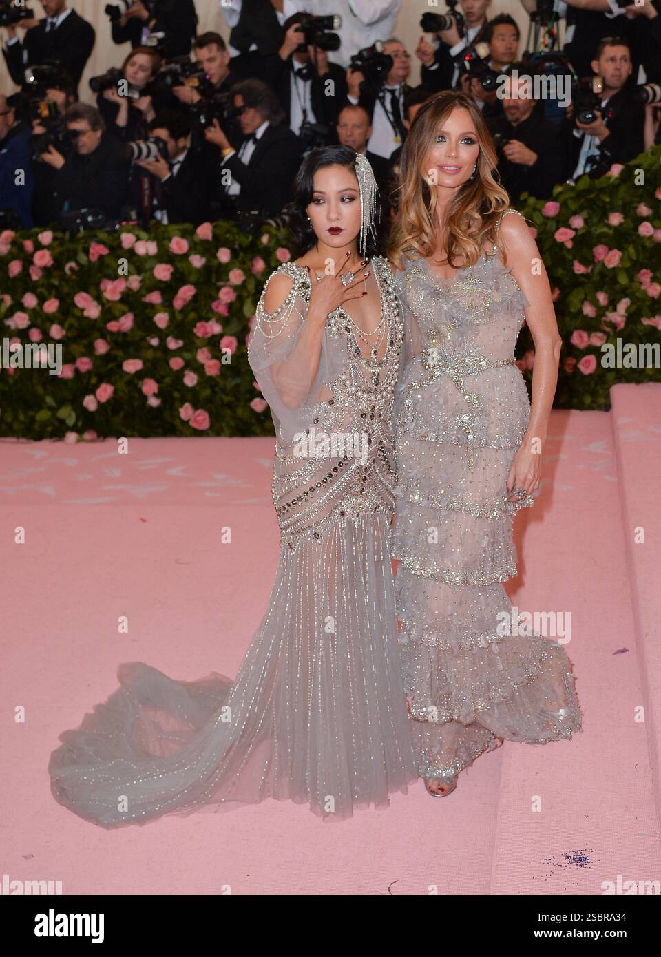 Constance Wu and Georgina Chapman (R) arriving at the 2019 Met Gala ...