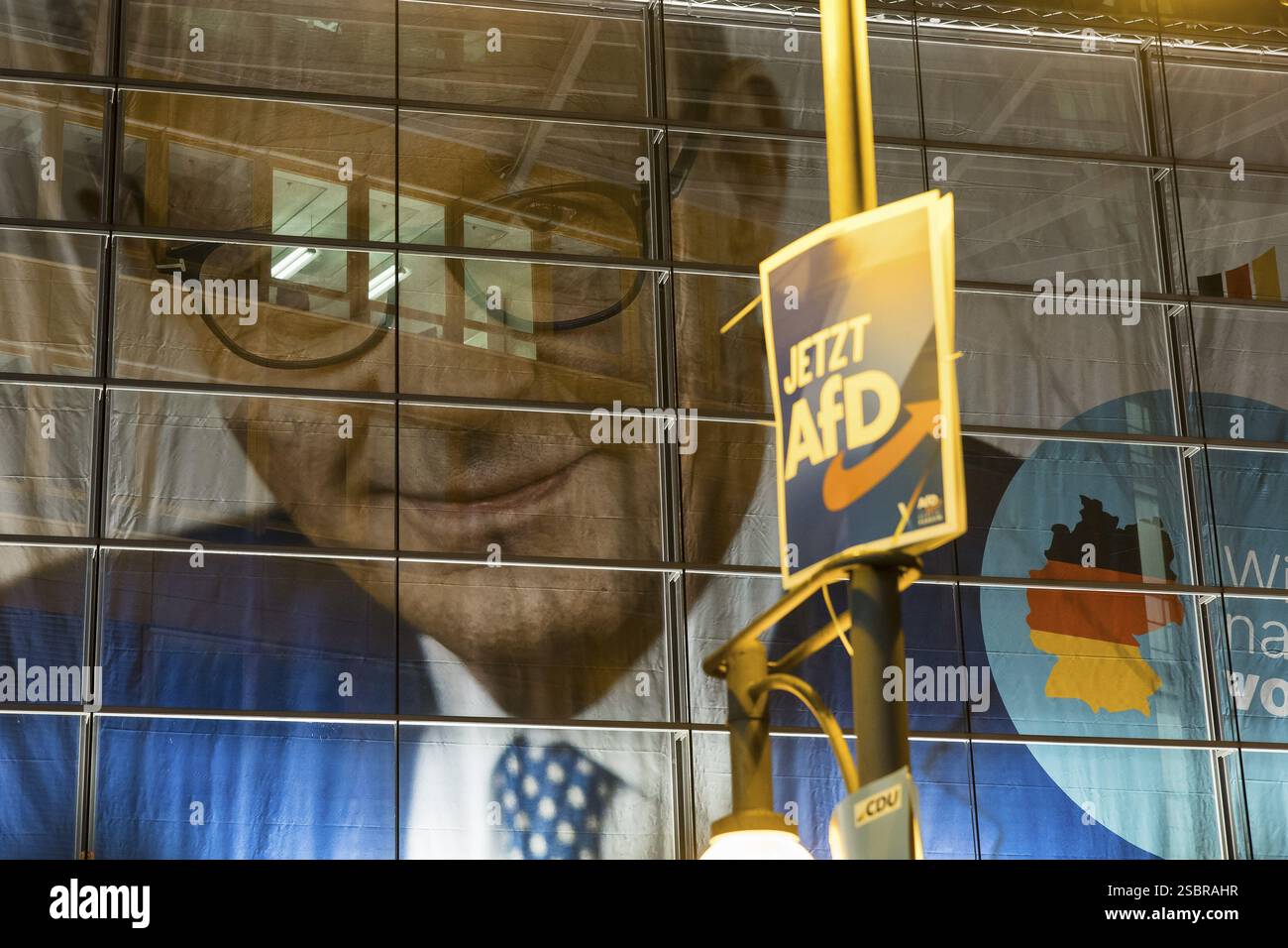 Banner with the likeness of Friedrich Merz behind an AfD election ...