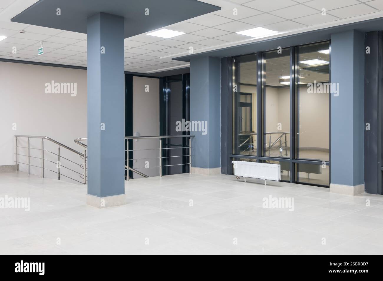 panorama view in empty modern office hall with columns, doors, stairs ...