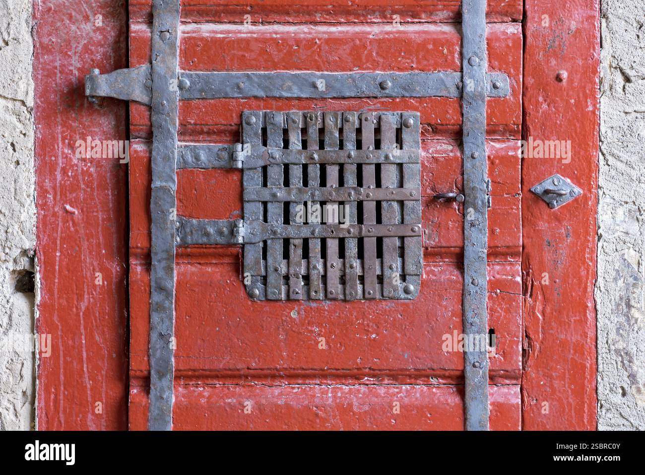 Wrought-iron grilles and fittings, red wooden door to dungeon, dungeon ...