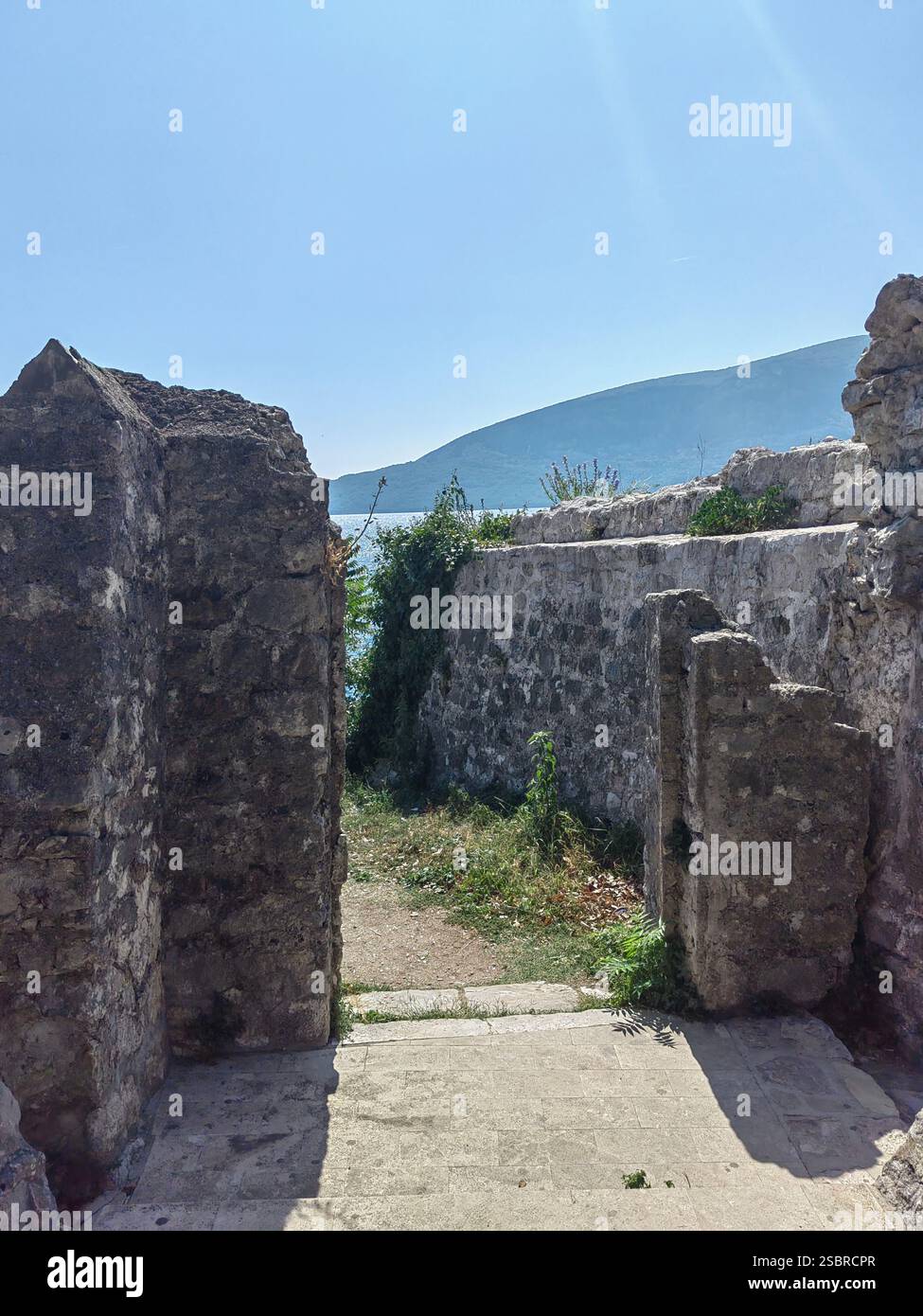 Stone ruins in an old town on the seashore in Montenegro Stock Photo ...