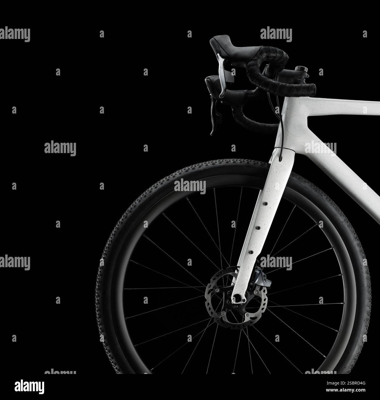 Striking silhouette of white gravel bike with brilliant glare effect ...