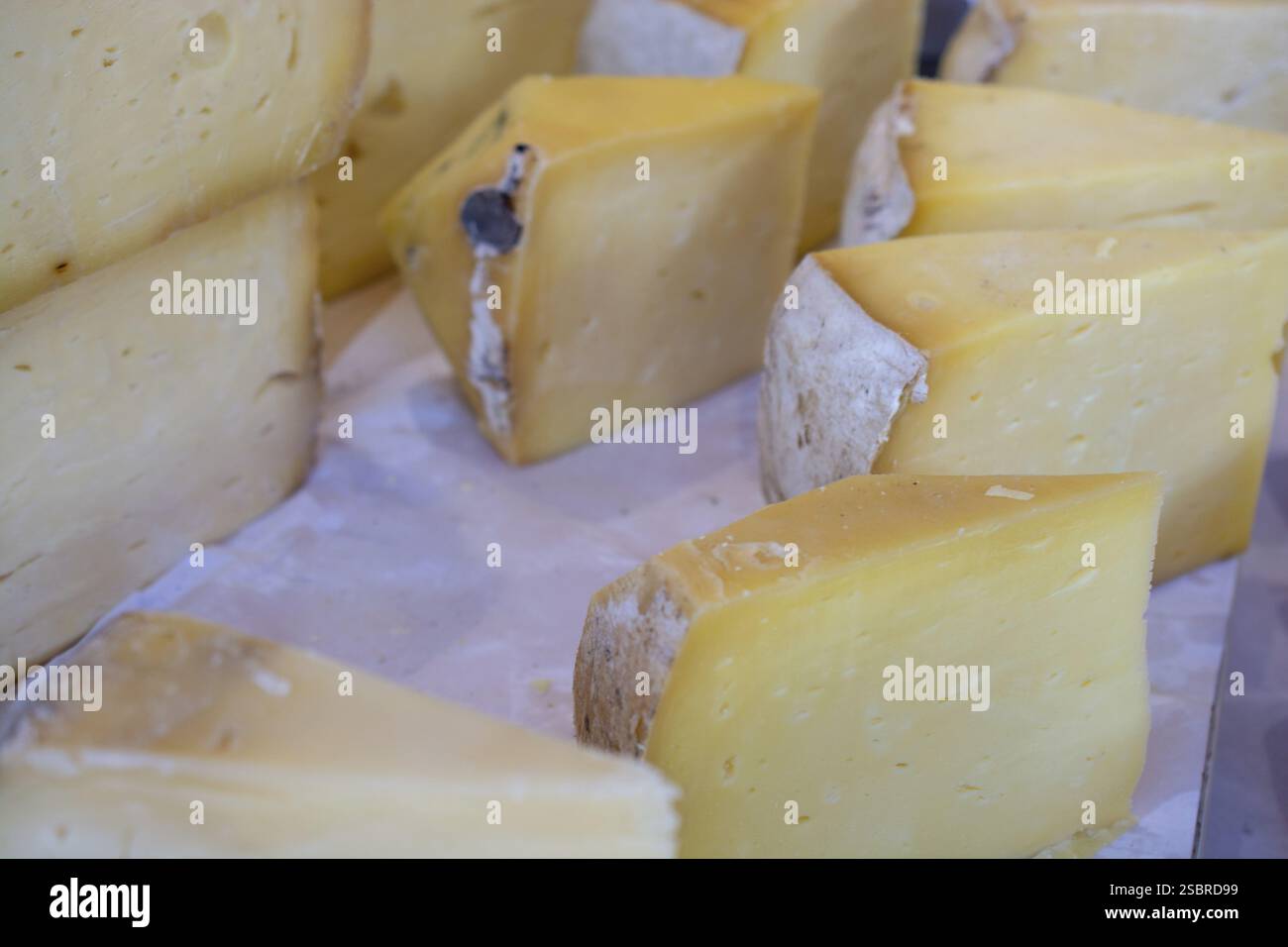 Cuts of kashkaval or kasseri cheese for sale on the shelf Stock Photo ...