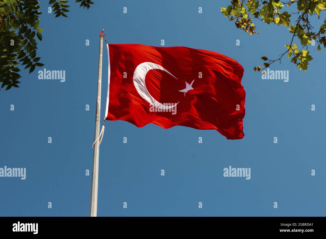 Turkish national flag with white star and moon on a pole in sky Stock ...