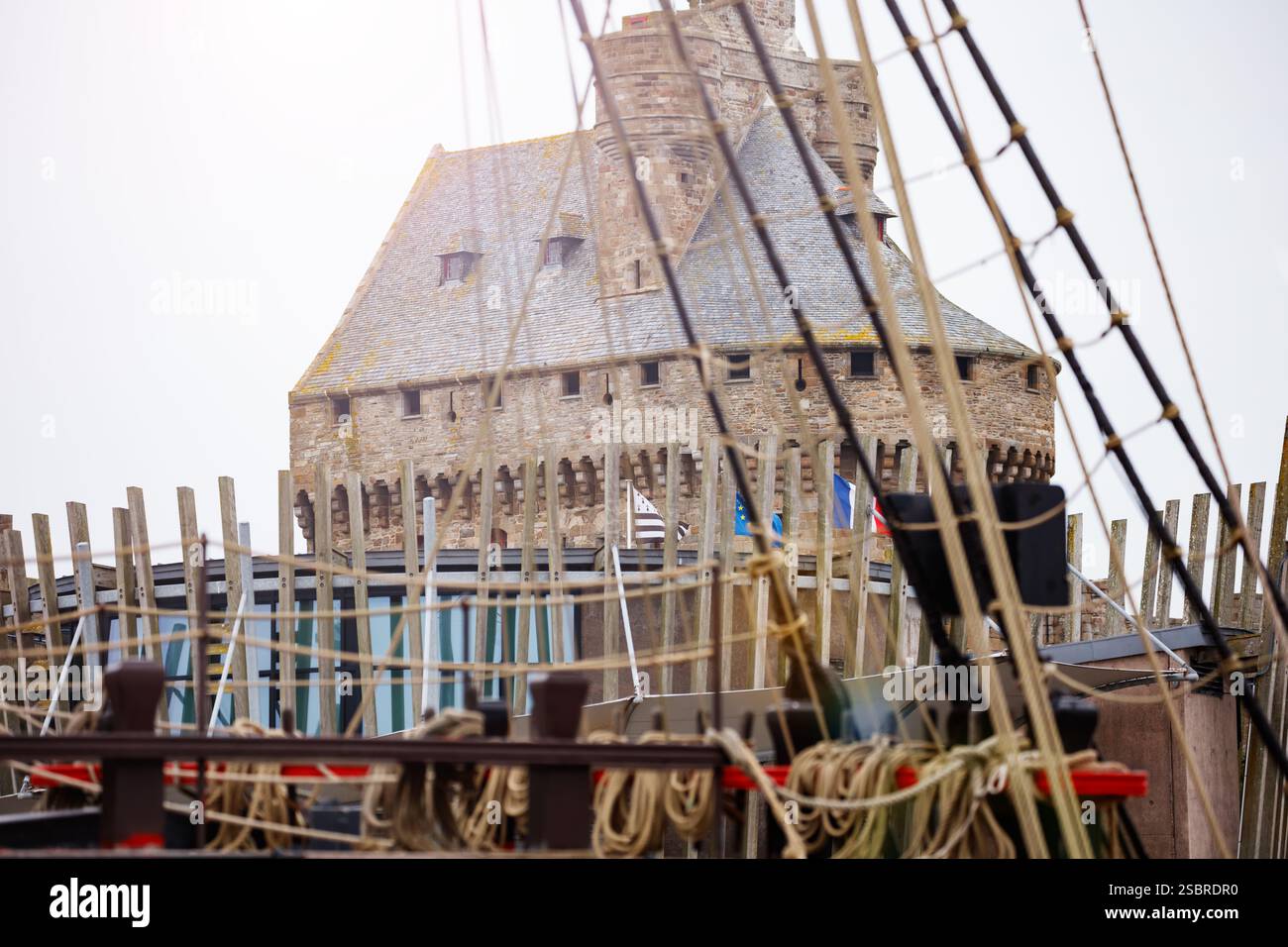 Ancient castle in Saint-Malo through ship ropes at port, France Stock ...