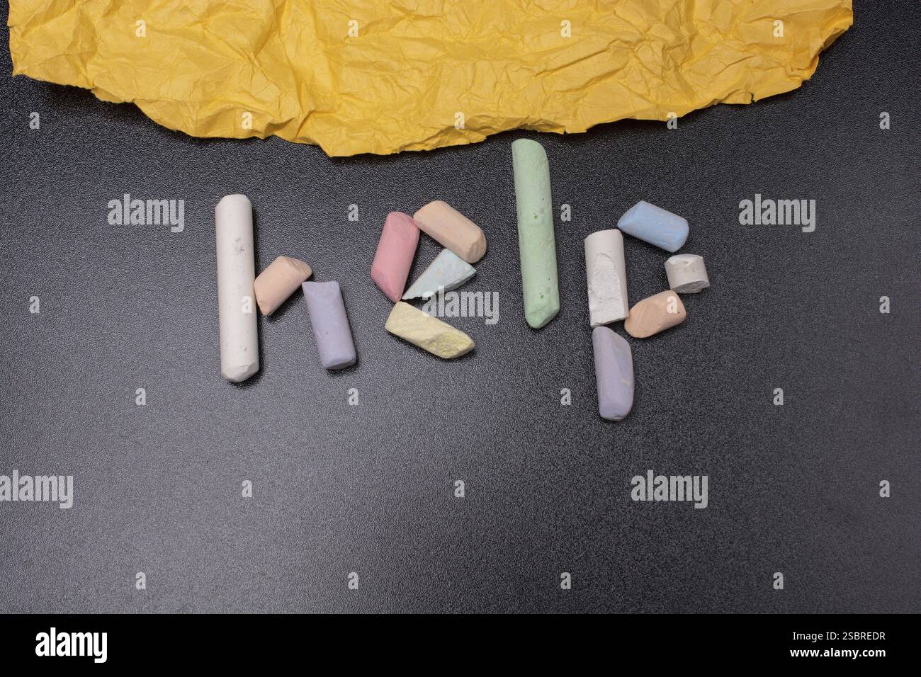 Help word written incoloured chalk on a black chalkboard Stock Photo ...