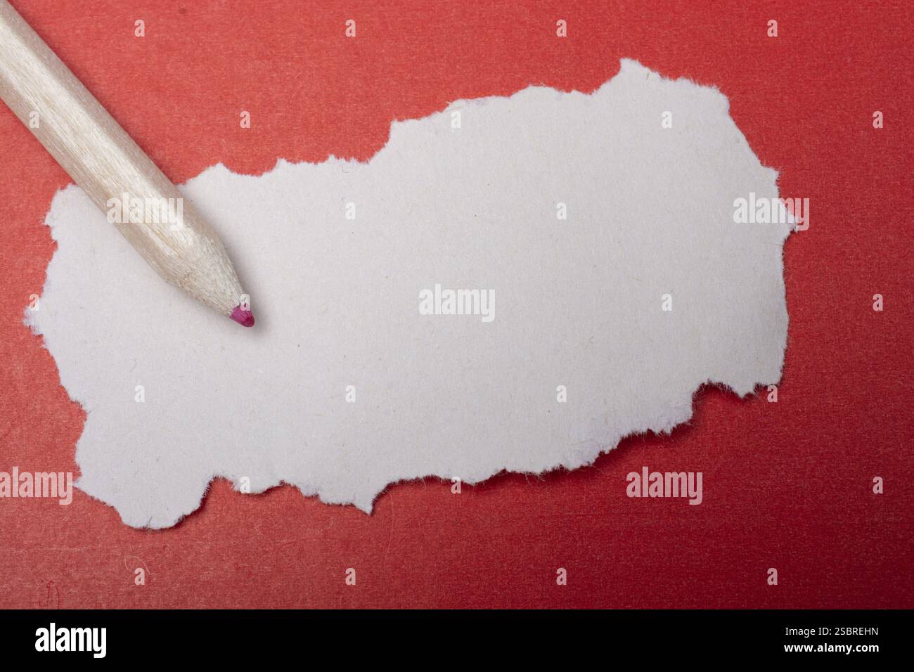 Wooden pencil and torn note paper for text or message Stock Photo - Alamy