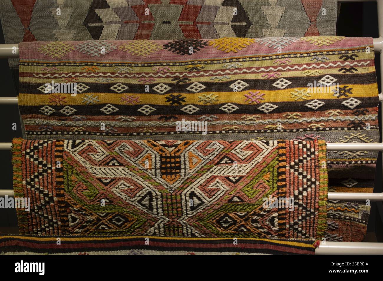 Traditional Turkish rug textile with patterns in bazaar Stock Photo - Alamy