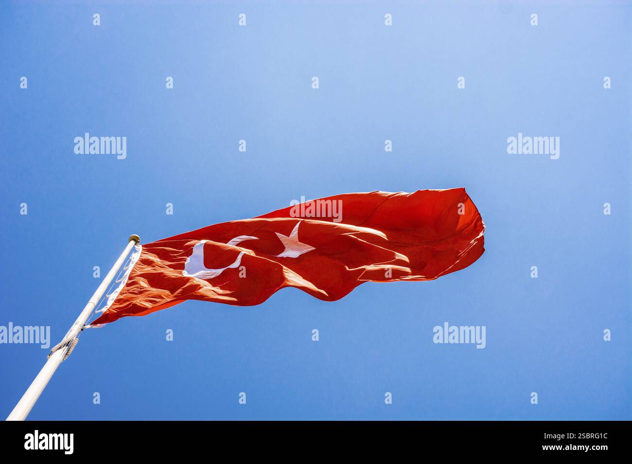 Turkish national flag with white star and moon on a pole in sky Stock ...