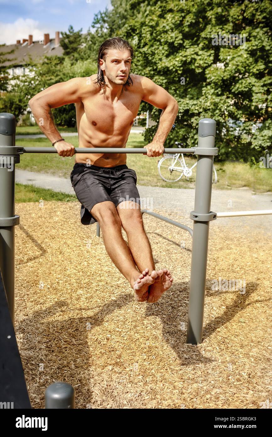 Young man exercises sports In the park - fitness concepts Stock Photo ...