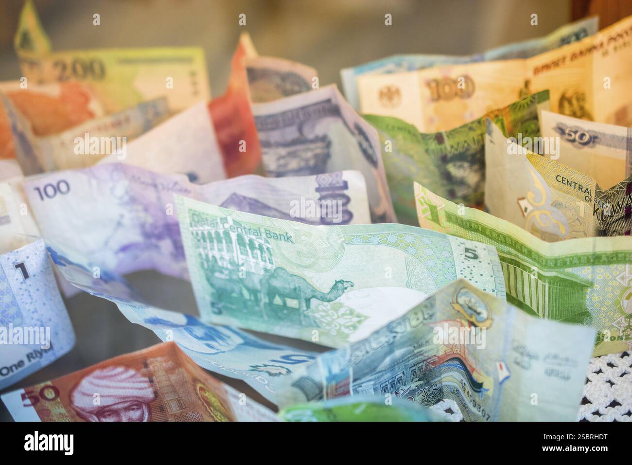 Various colorful banknotes, mostly froma arab peninsula. Saudi riyal ...