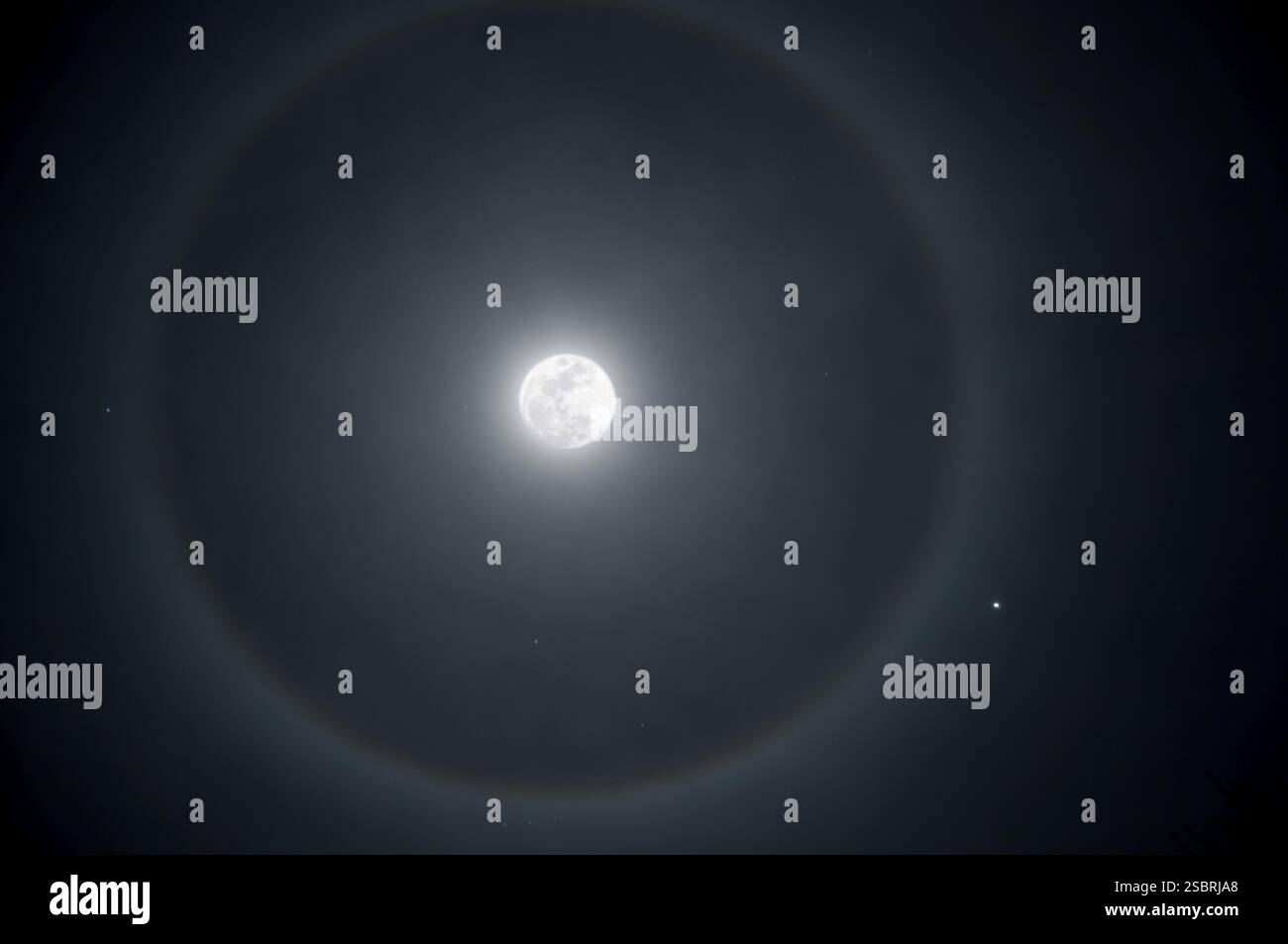 Full moon with a ring of ice in the atmosphere Stock Photo - Alamy