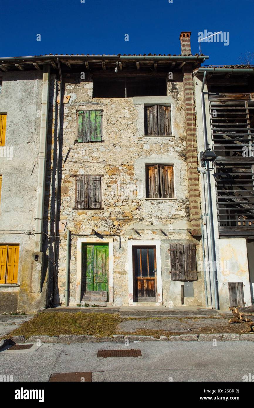 An abandoned traditional stone house in the historic village of Andreis ...