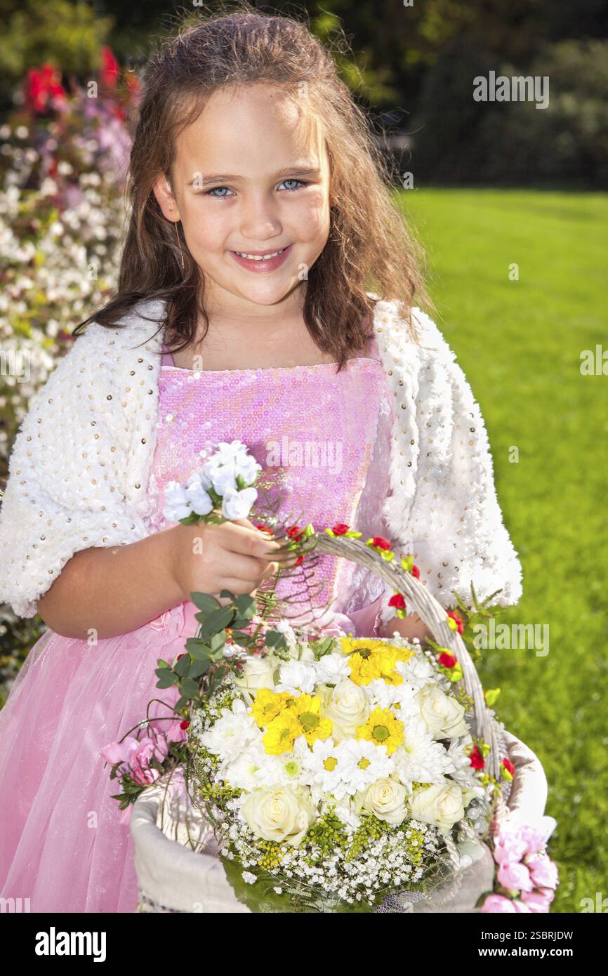Wedding - Flower Girl in a beautiful rosa dress Stock Photo - Alamy