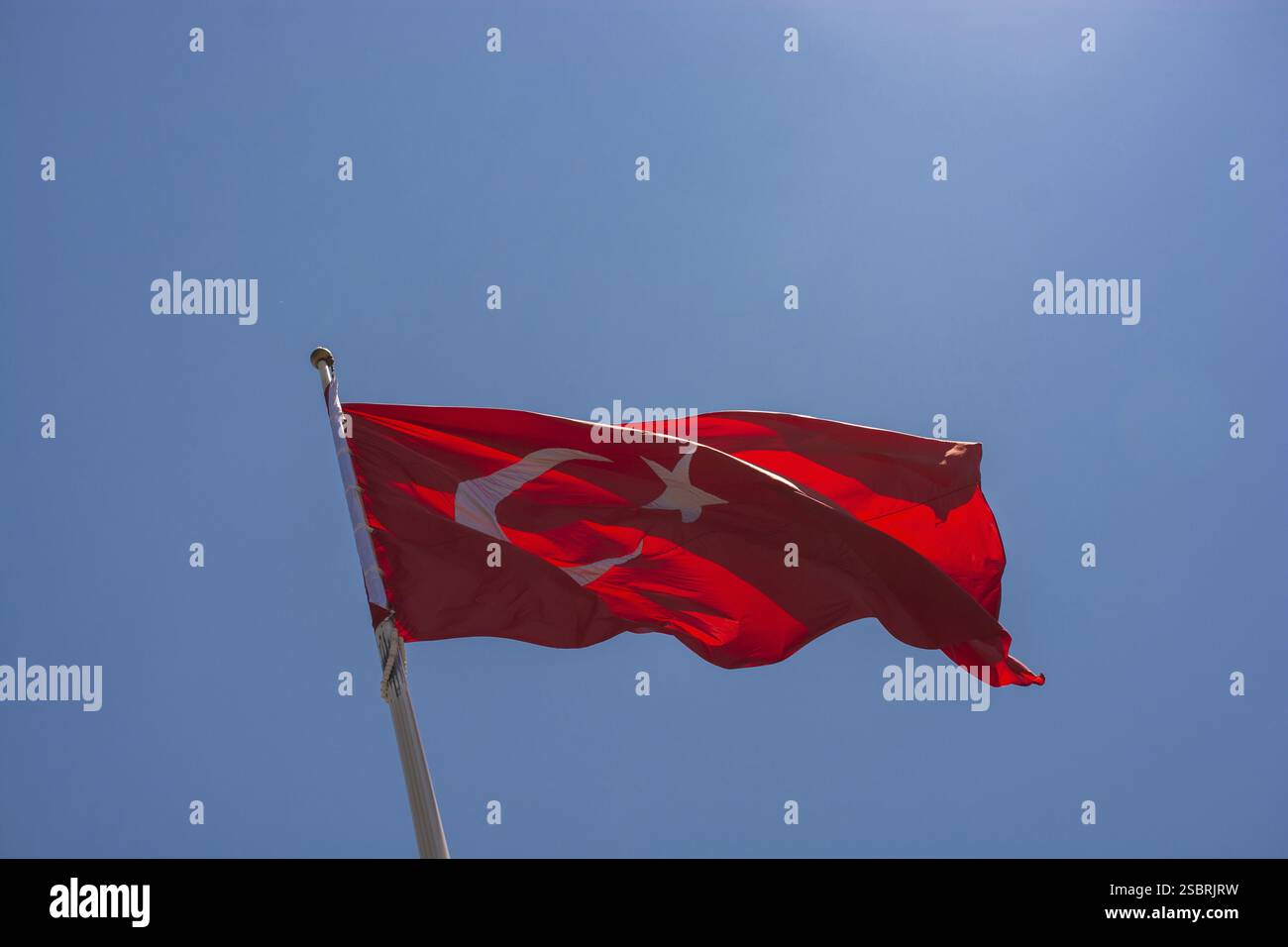 Turkish national flag with white star and moon on a pole in sky Stock ...