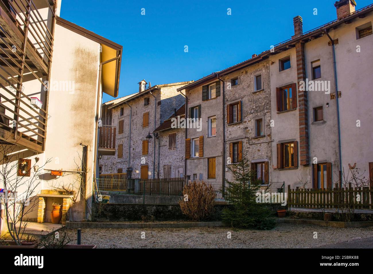 Traditional stone mountain houses in the historic village of Andreis in ...