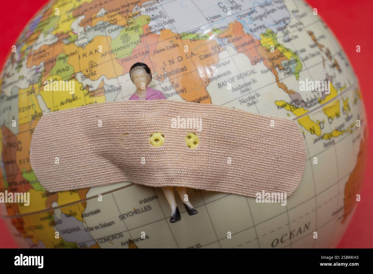 Earth with bandaid Solidarity and aid to countries in need concept ...