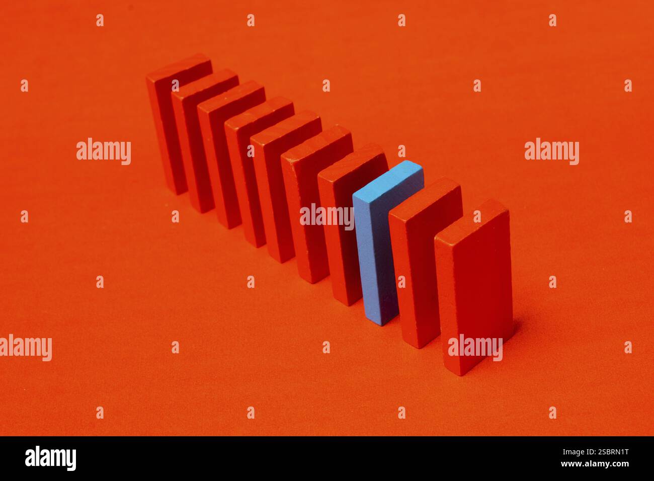 Colorful dominoes. Rainbow colored chain reaction Stock Photo - Alamy