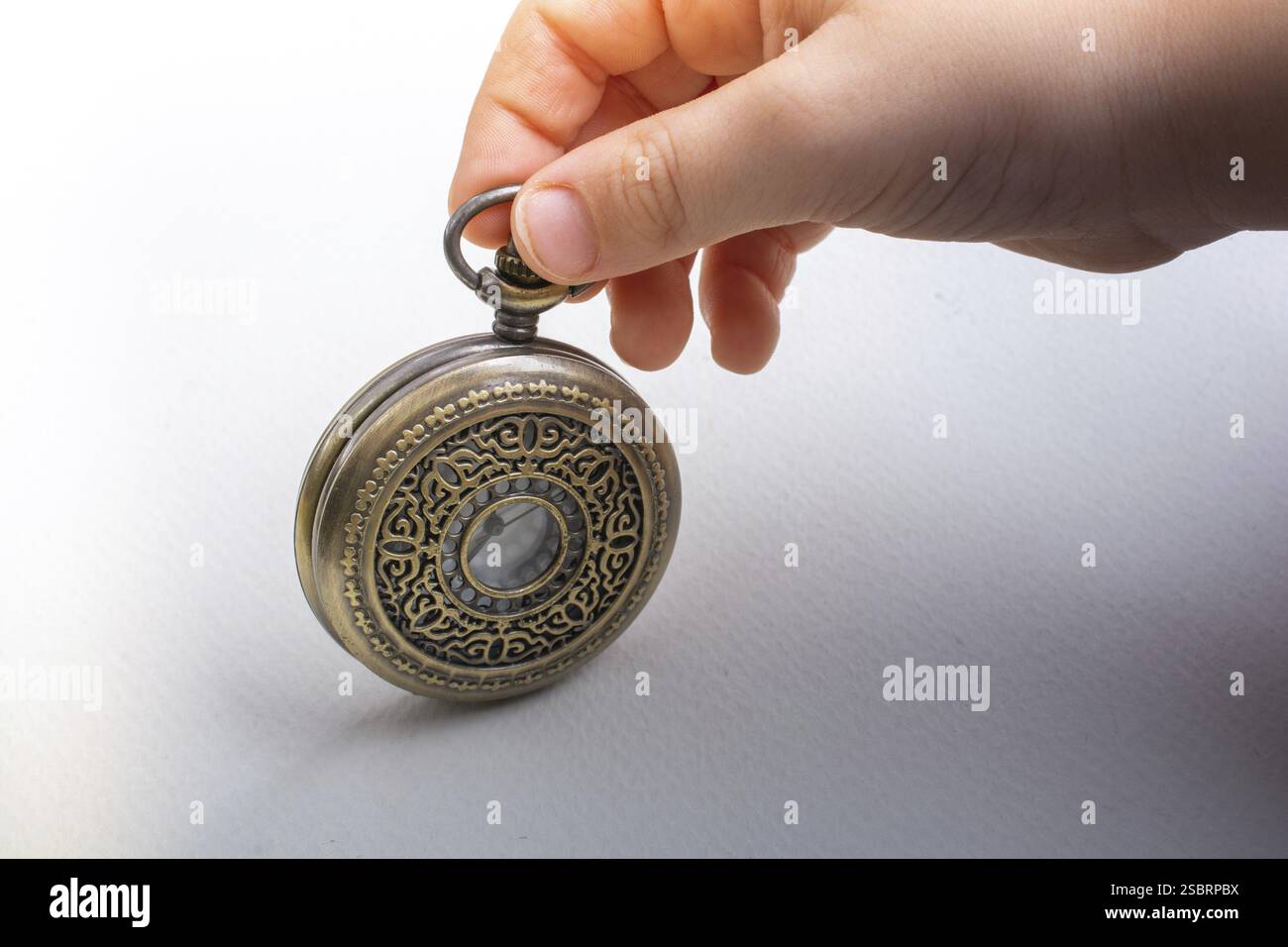 Retro style pocket watch in the hand Stock Photo - Alamy