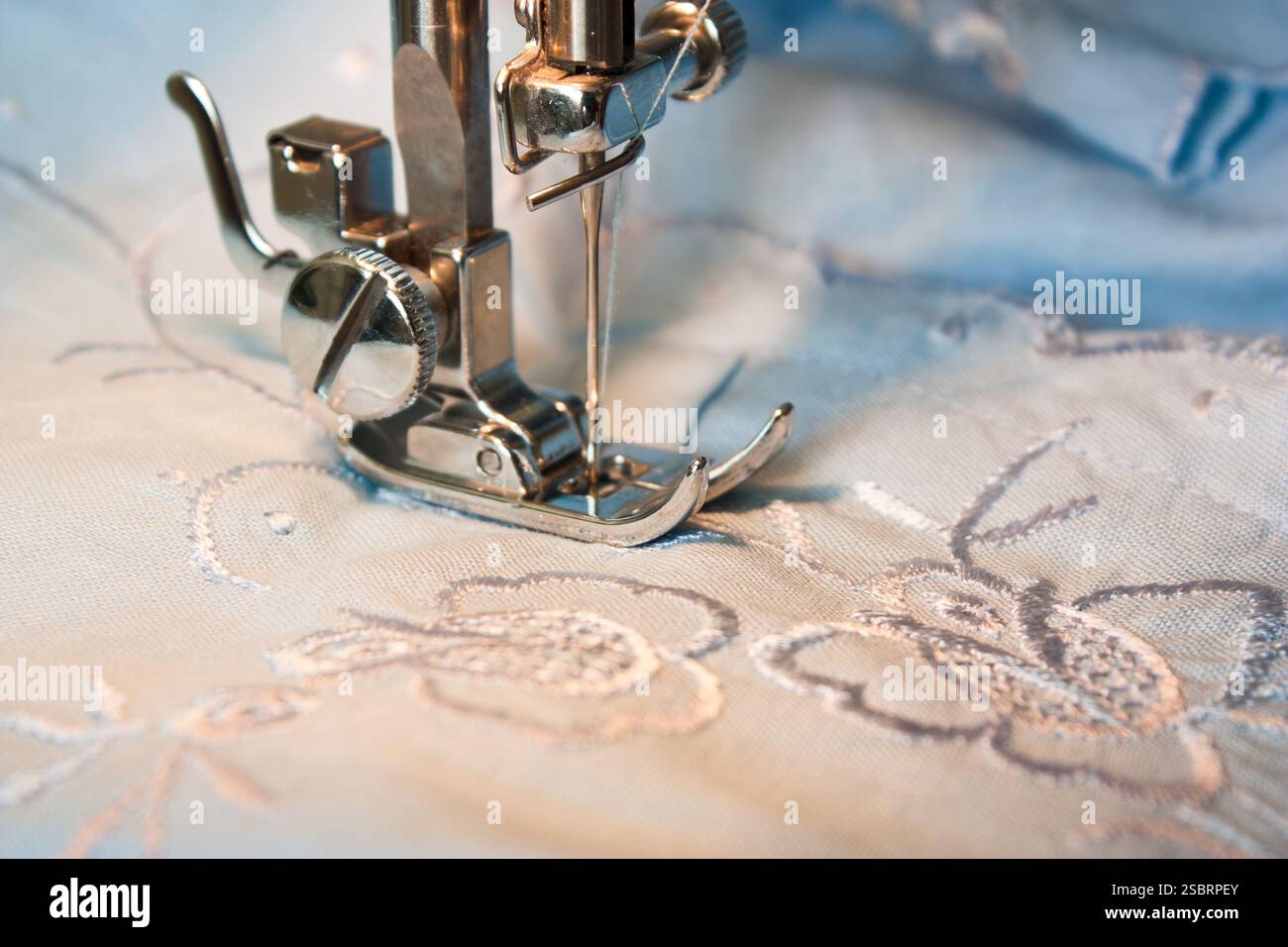 sewing machine and item of clothing Stock Photo - Alamy