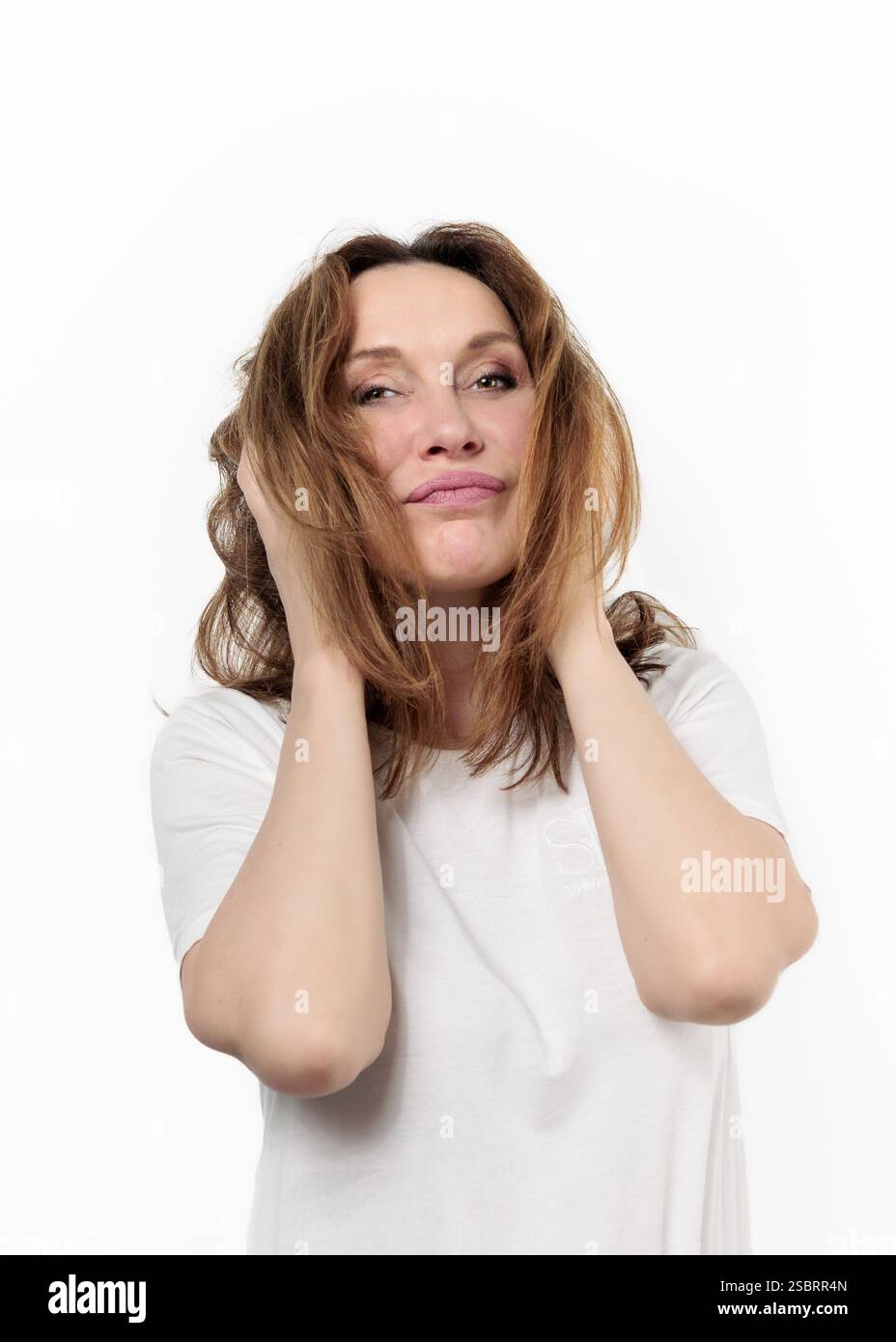 Happy mature woman laughing standing isolated on white background ...