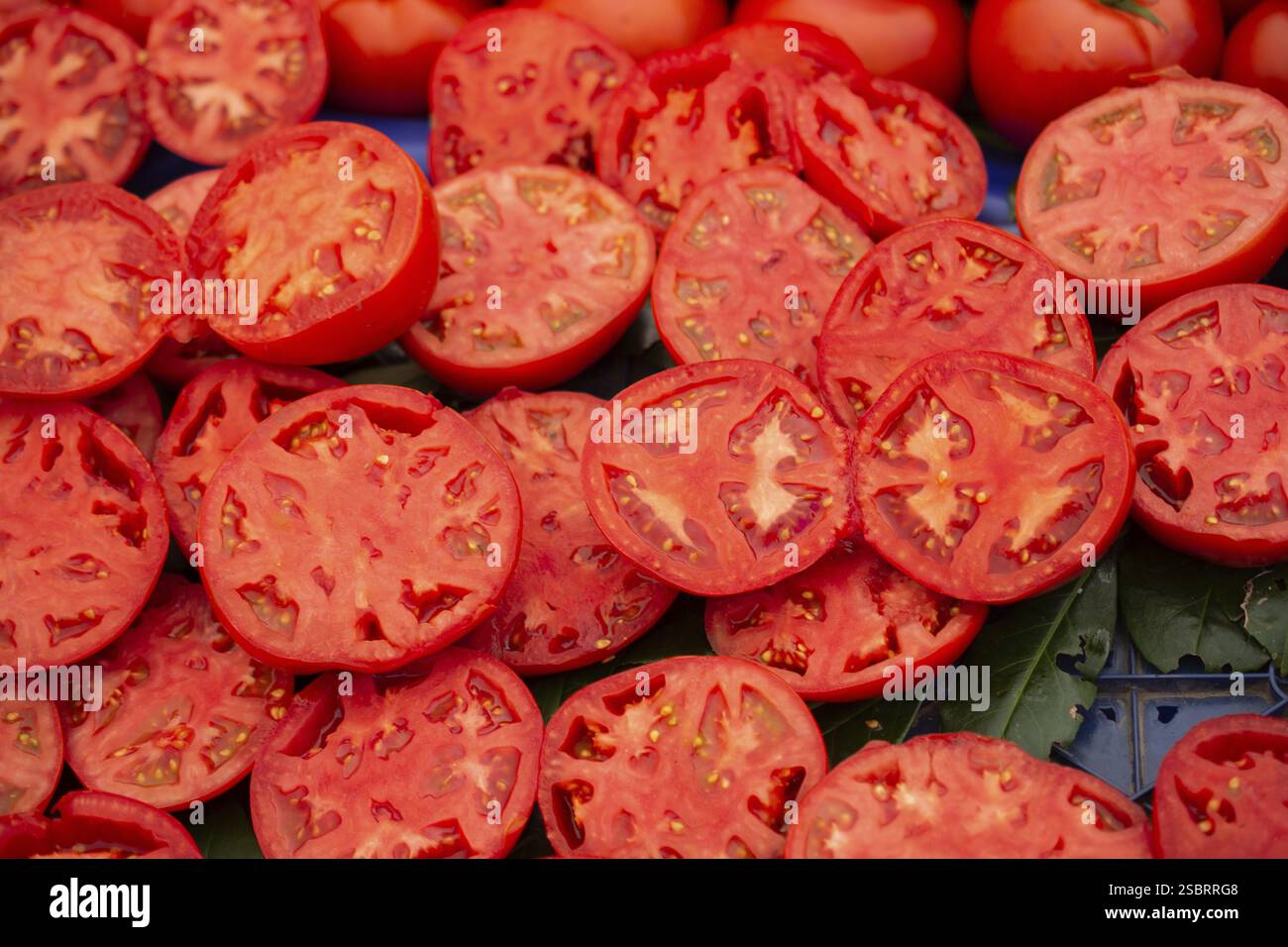 Fresh cut tomato at grocery store for food backgrounds concept Stock ...