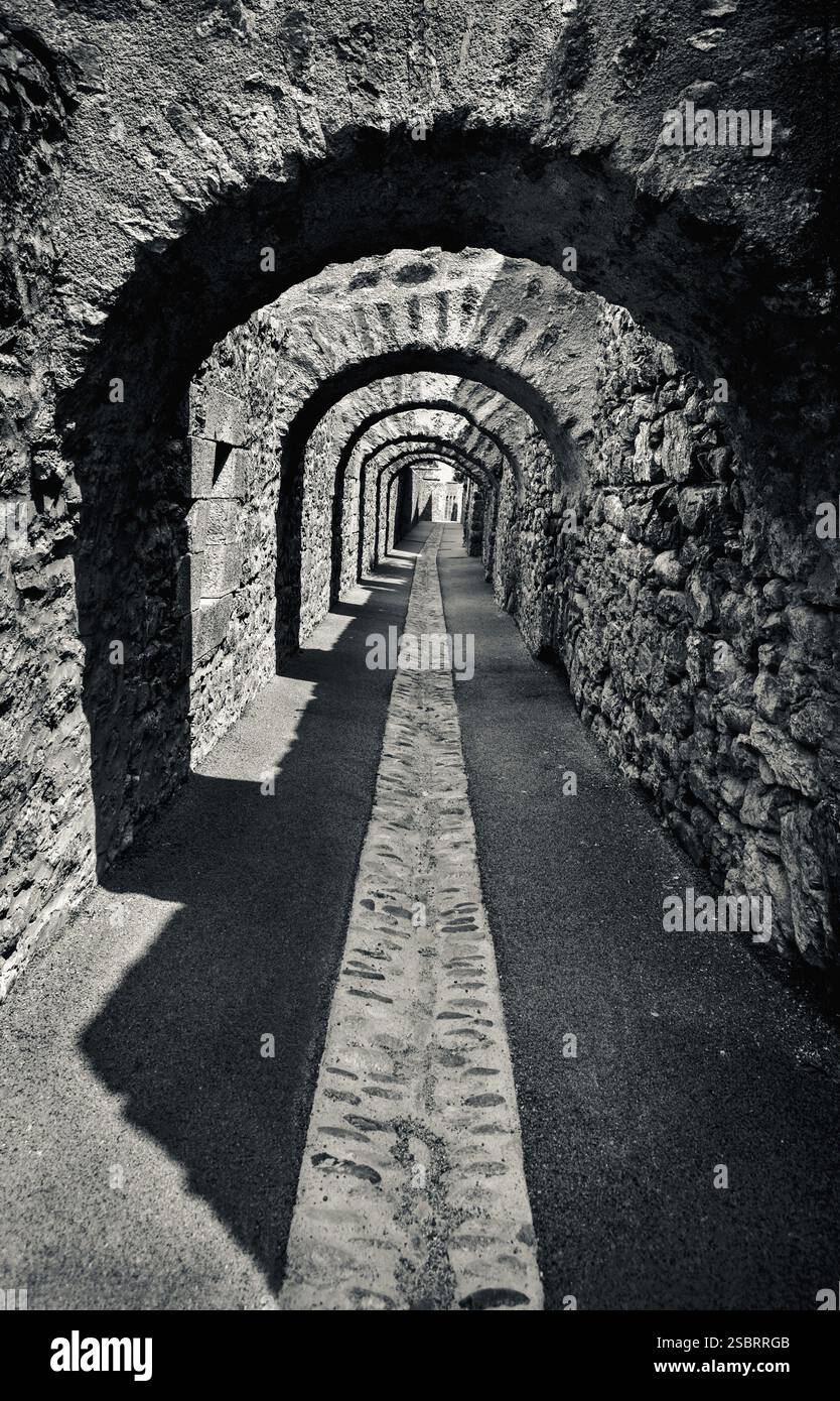 Old stone arcade, corridor in castl. Monochrome photo Stock Photo - Alamy