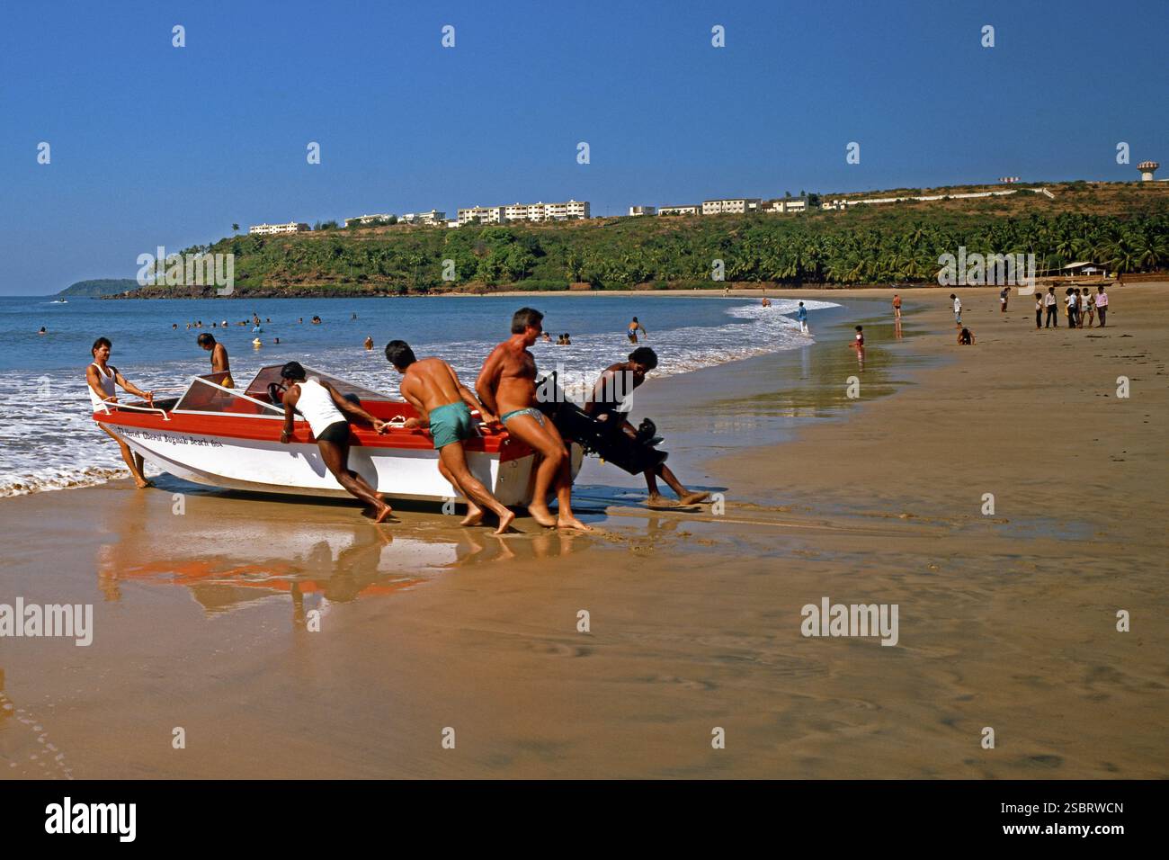 Beach at the Hotel Oberoi Bogmalo Beach, a motorboat is pushed into the ...