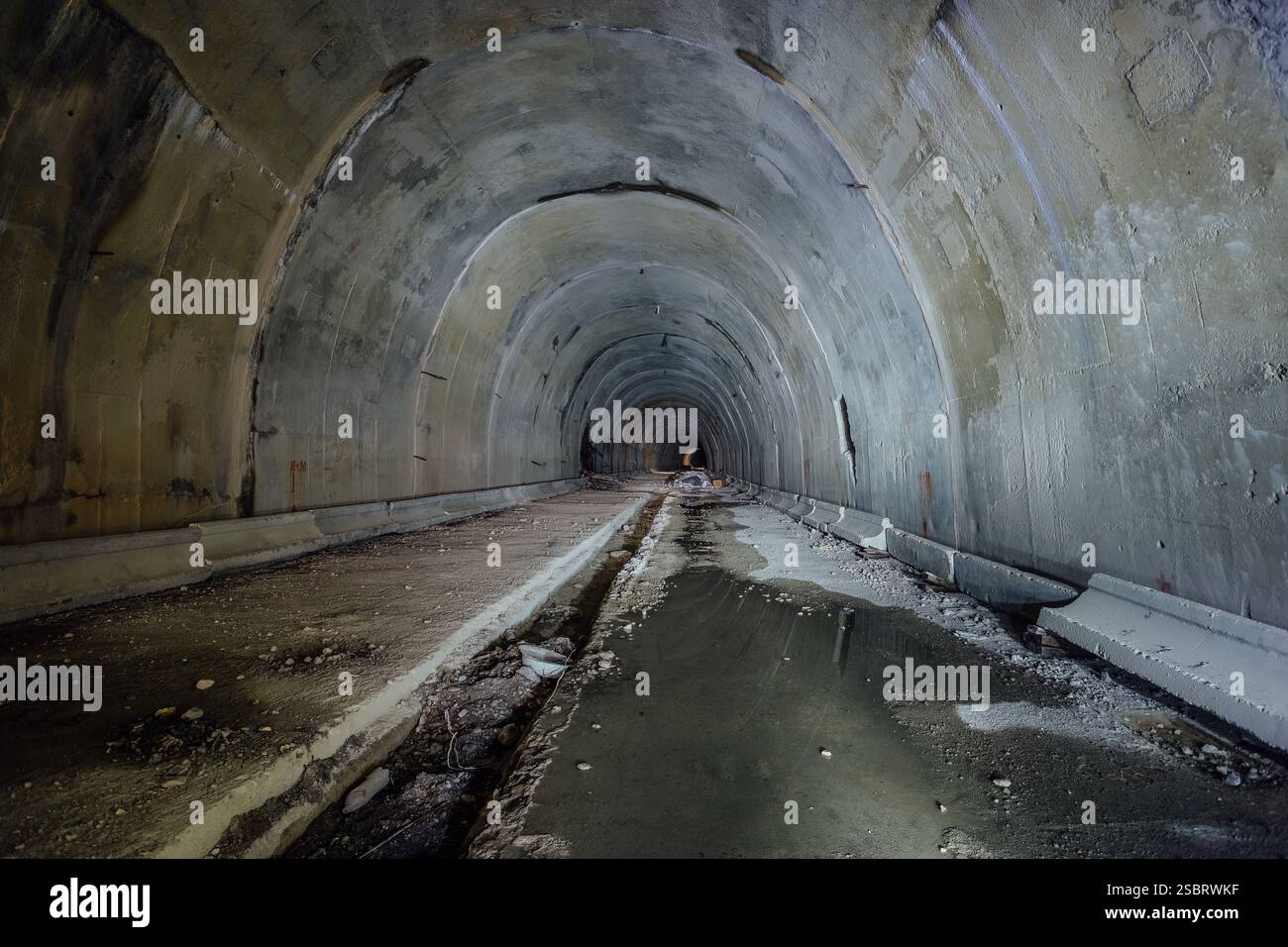 Dark large tunnel at old underground bunker Stock Photo - Alamy