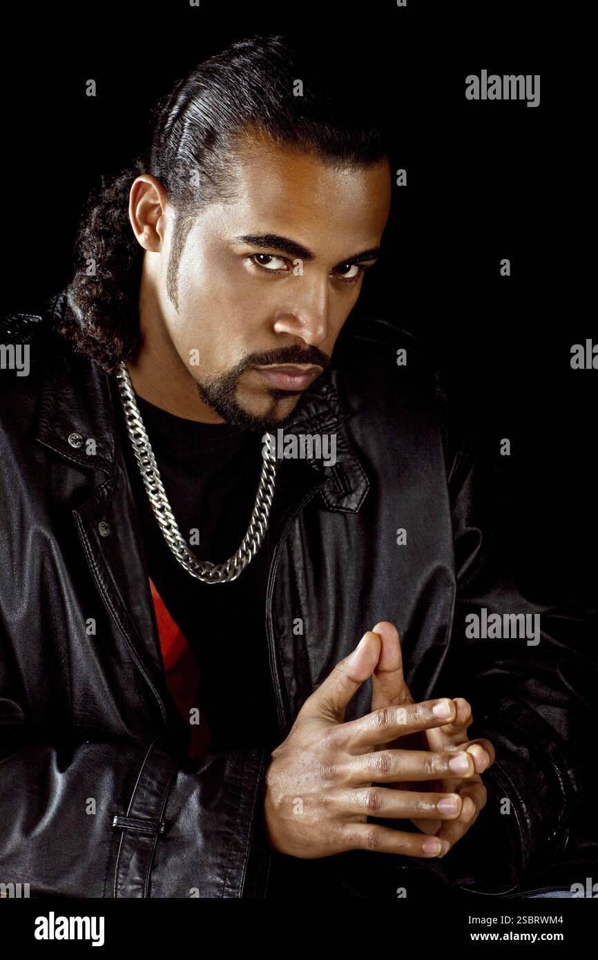 Low-key portrait - sad and angry looking man Stock Photo - Alamy