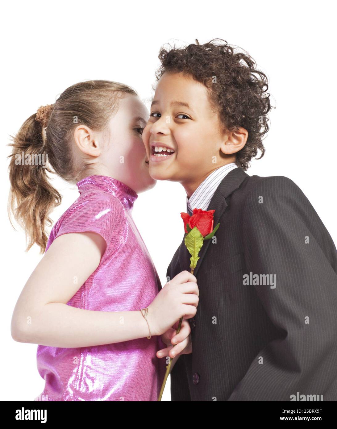 Cute little girl kissing a boy, isolated on white background Stock Photo - Alamy